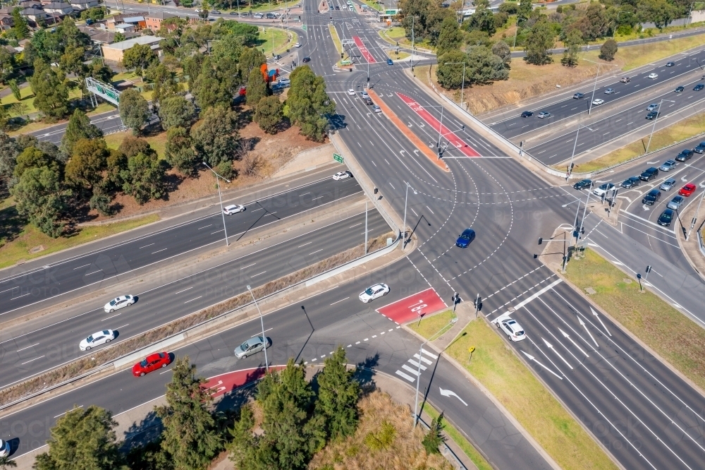 Image of Horizontal aerial shot of a freeway overpass with cars, trees ...