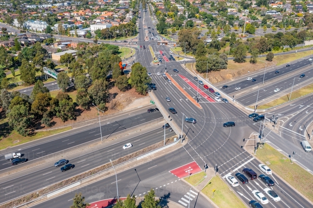 Image of Horizontal aerial shot of a freeway overpass with cars, trees ...
