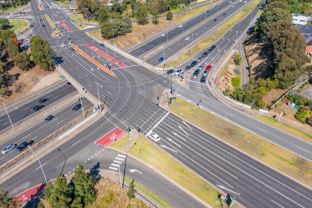 Image of Horizontal aerial view of a freeway overpass with cars, trees ...