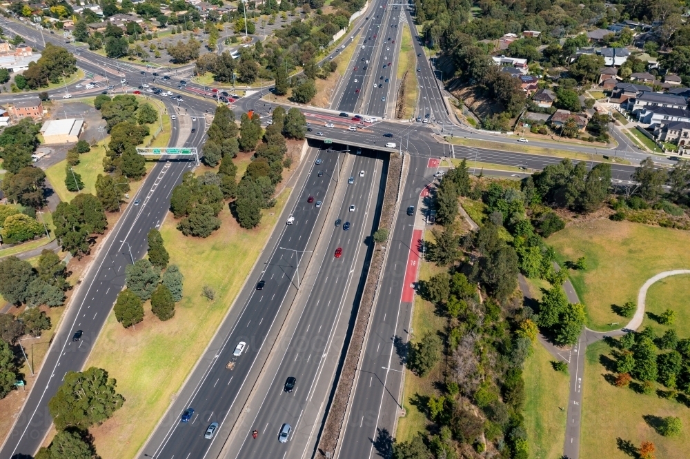 Image of Horizontal aerial view of a freeway overpass with cars, trees ...
