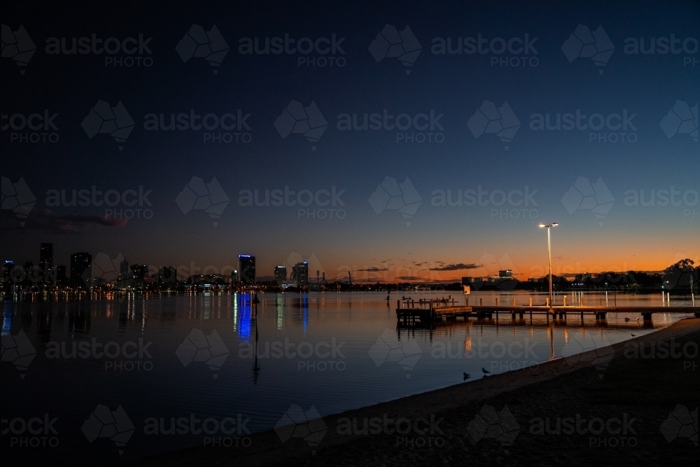Image of horizontal shot of a jetty with lamp post during sunset with ...