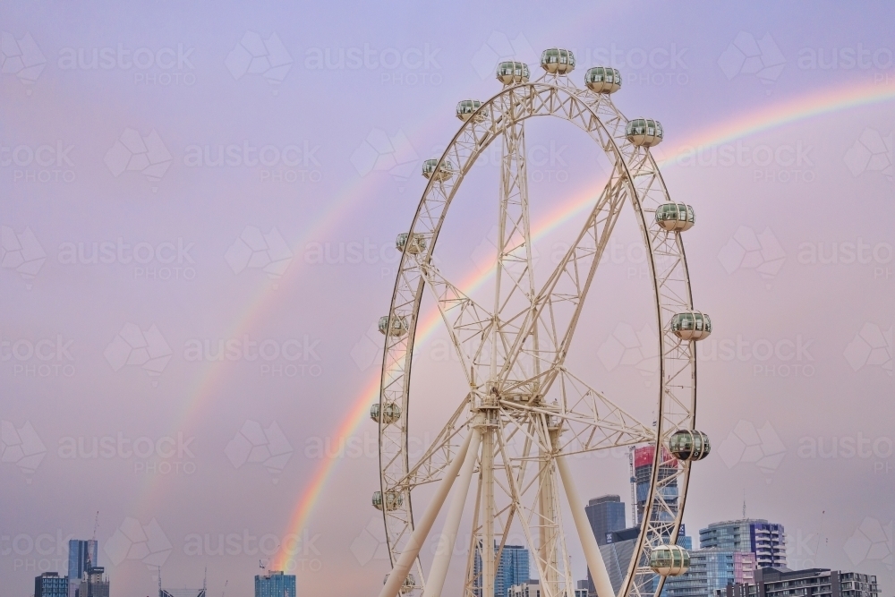 Image of Horizontal shot of a double rainbow behind a large modern ...