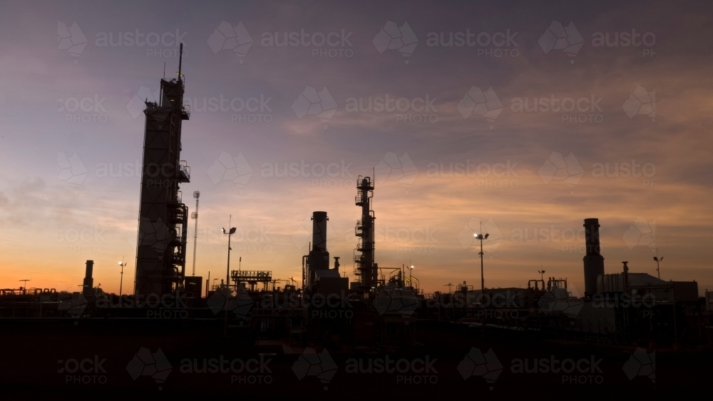 Image of Horizontal shot of an industrial plant at sunset - Austockphoto