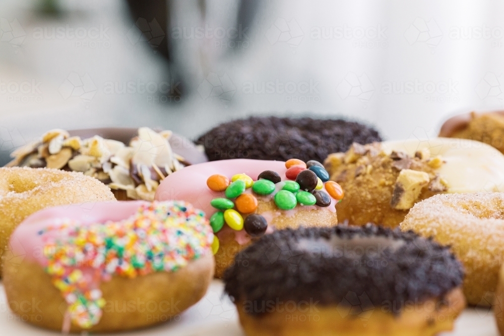 Image of Horizontal shot of donuts with different toppings. - Austockphoto