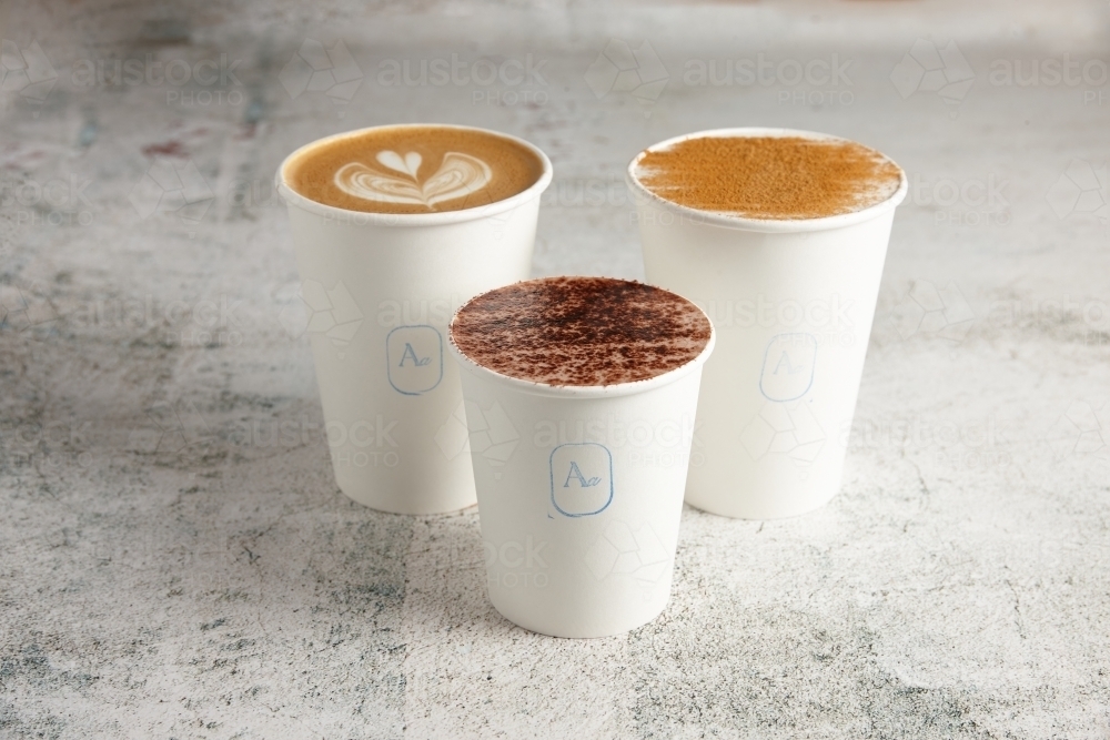 Image of Horizontal shot of three take away coffees - Austockphoto