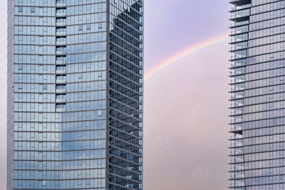 Image of Horizontal shot of a rainbow between two high rise buildings ...