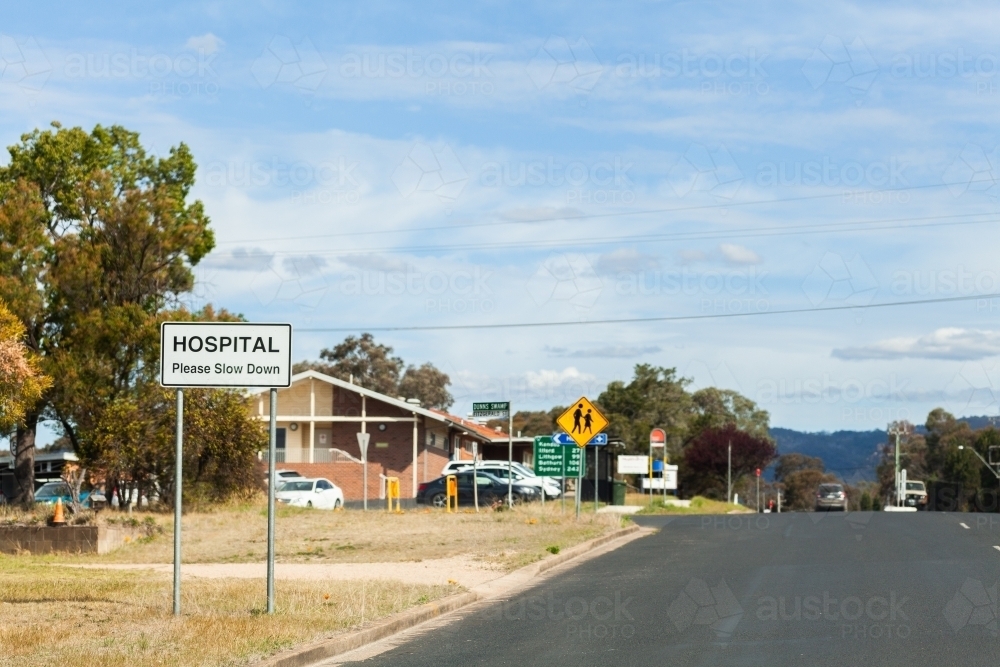 Image of Hospital please slow down sign in small country town before ...