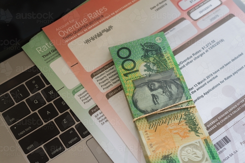 Image of household paper bill with money - Austockphoto