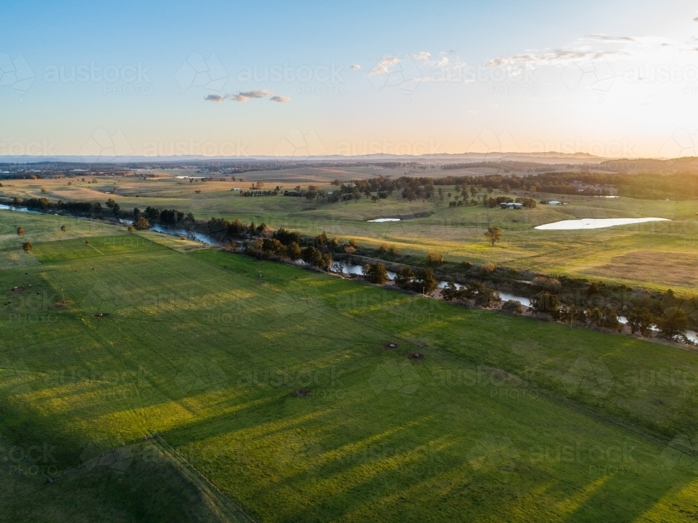 Image of Hunter River flowing between green farm paddocks in Hunter ...