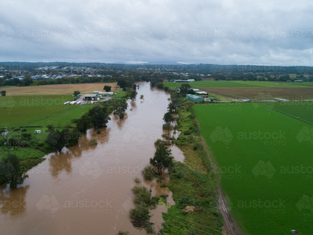 Image of Hunter River rising filling with brown floodwater during ...