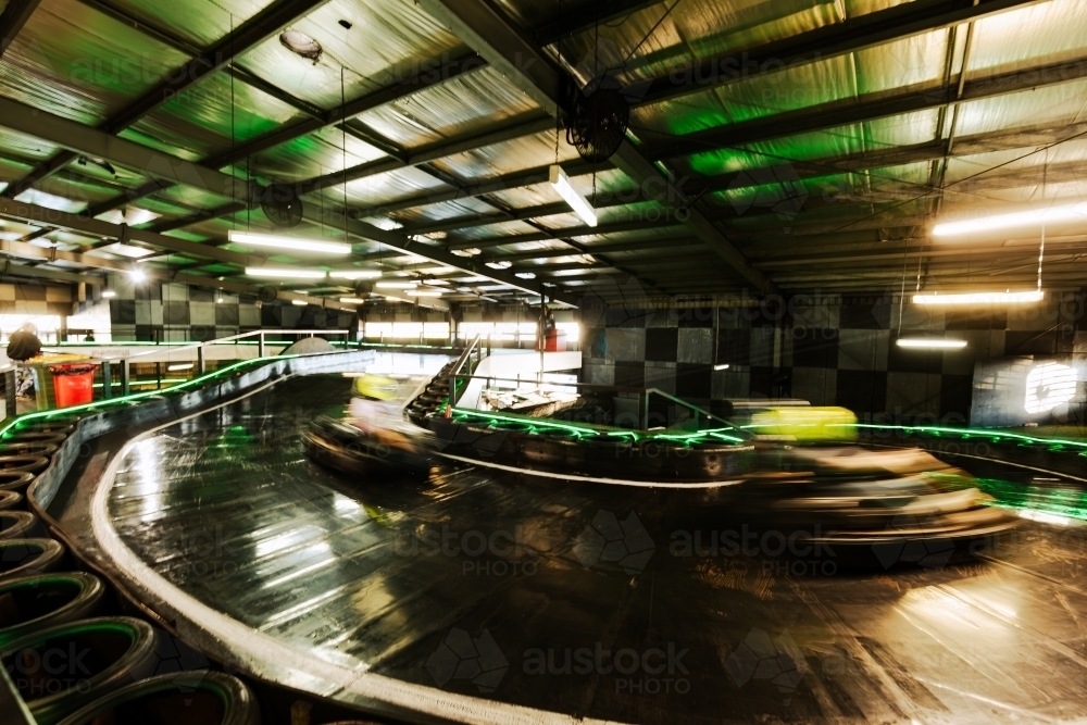 Image of Indoor Go Kart race track with motion blur - Austockphoto