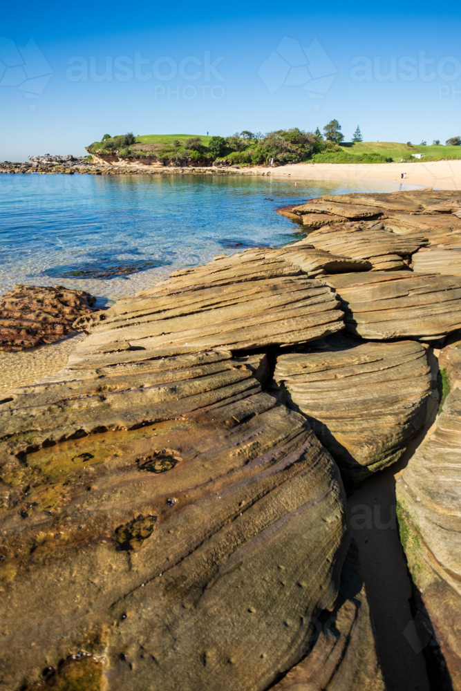 Image of interesting rock formation at Little Bay beach - Austockphoto