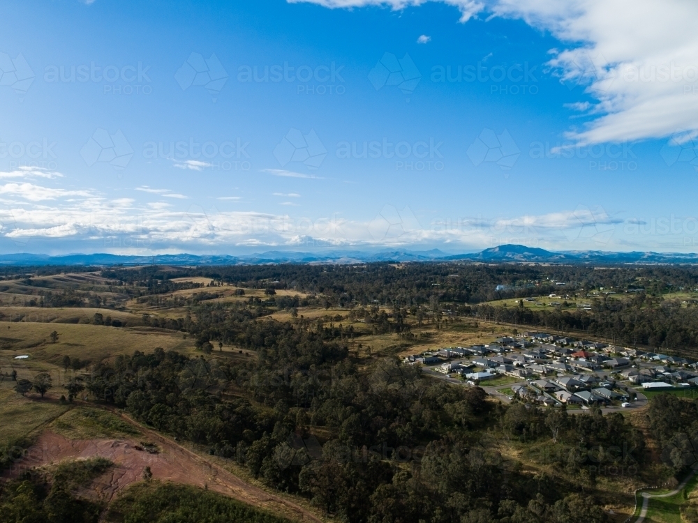 Image of intersection of bush and built environment treed land with ...