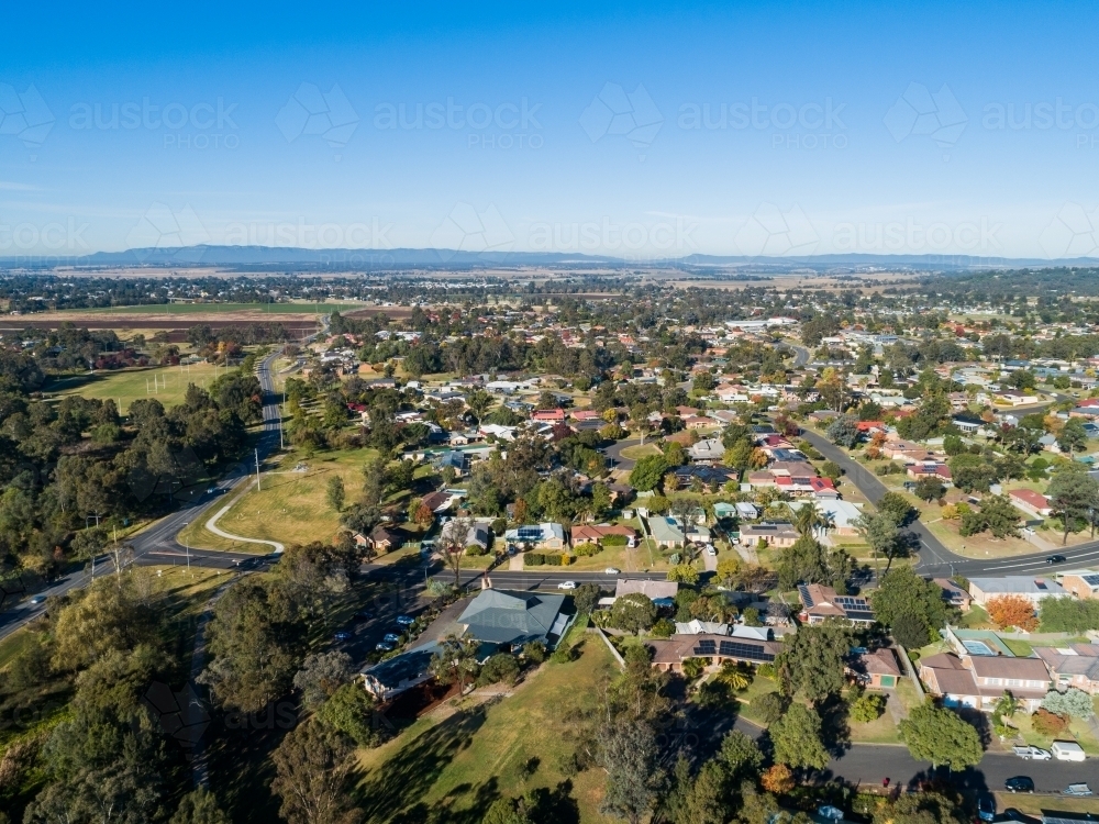 Image of Intersection of roads with church on one corner and houses ...