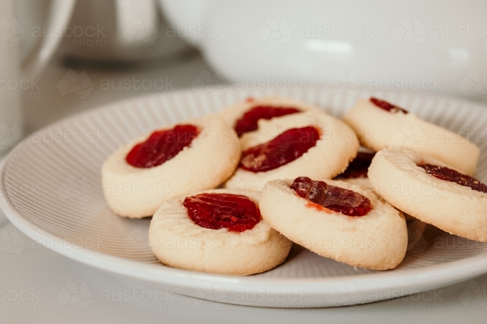 Image of Jam drop biscuits on a plate. - Austockphoto