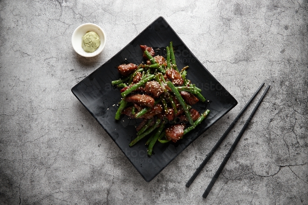 Image of Japanese style beef fillet on black plate - Austockphoto