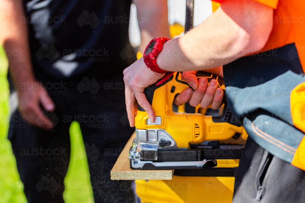 Image of jigsaw tool in use during demonstration for trade students ...