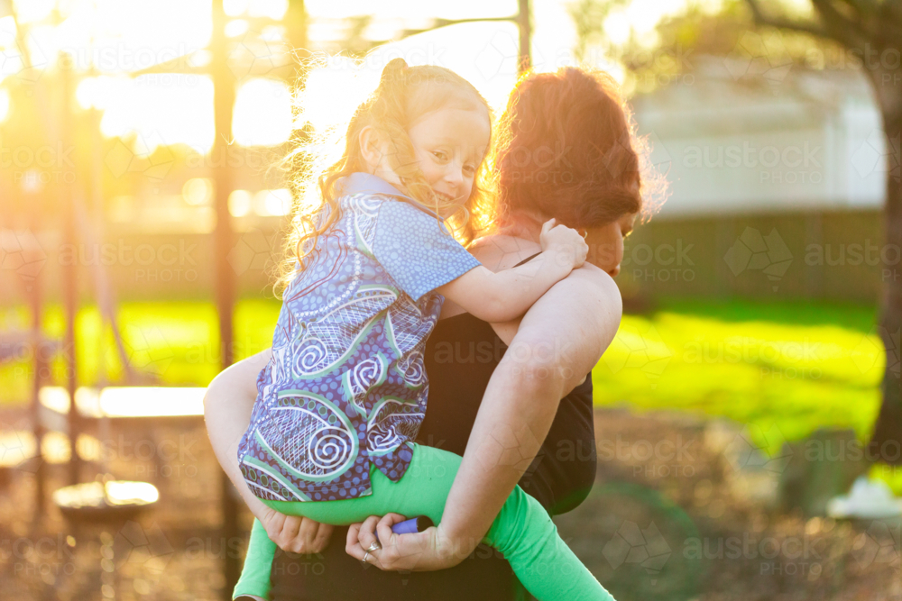 Image of Kamilaroi Aboriginal mum giving daughter a piggyback around ...