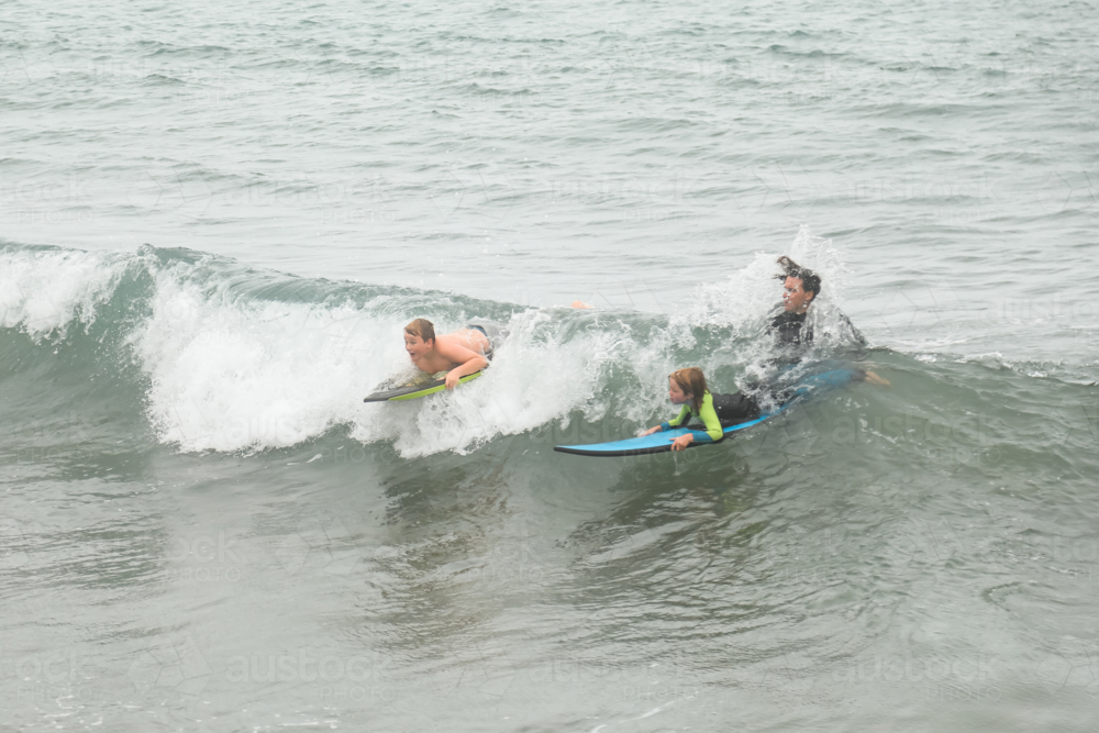 Image of Kids surfing and boogie boarding at the beach in Portland ...