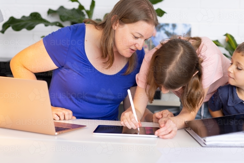 Image of lady in home office with children and girl drawing on tablet ...