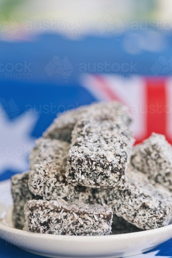 Image of Lamingtons with Aussie flag in background - Austockphoto