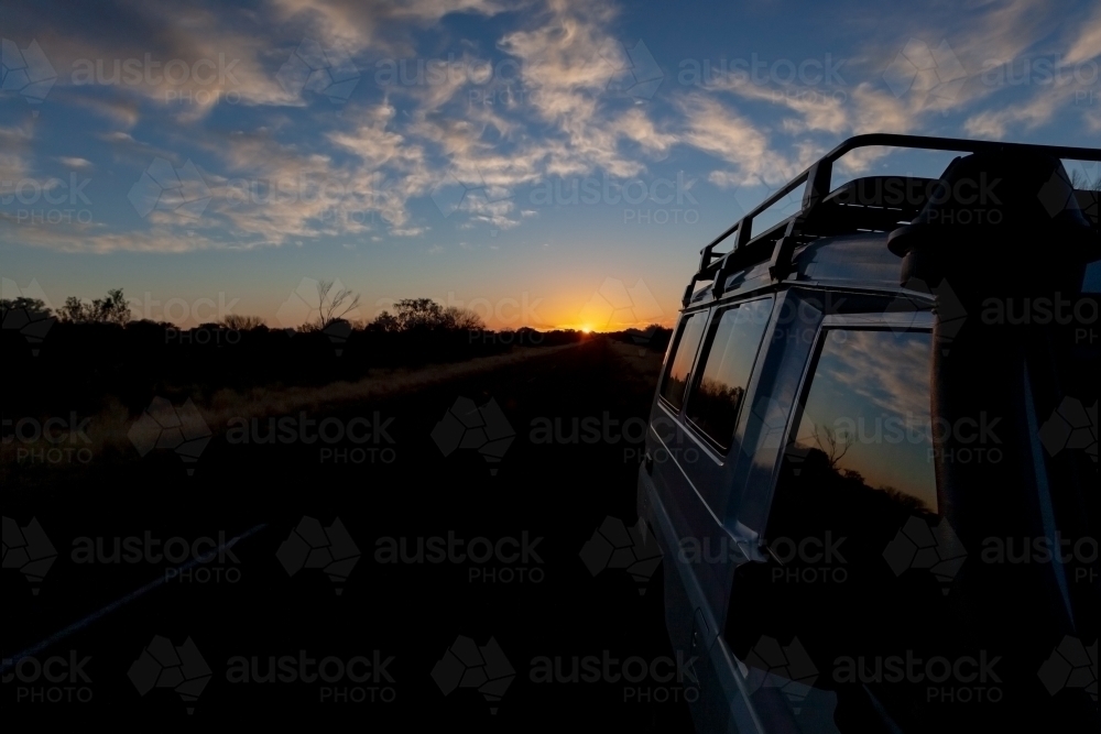 Image of Landcruiser vehicle on sunset in outback - Austockphoto