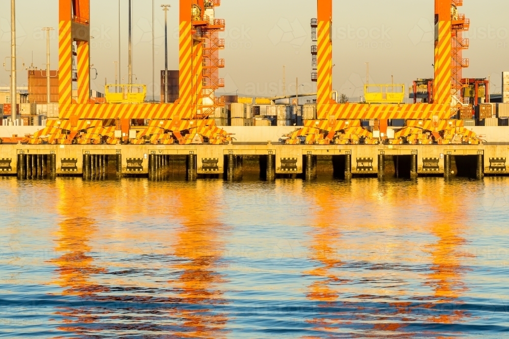 Image of Large crane bases on wheels at the Port of Brisbane - Austockphoto