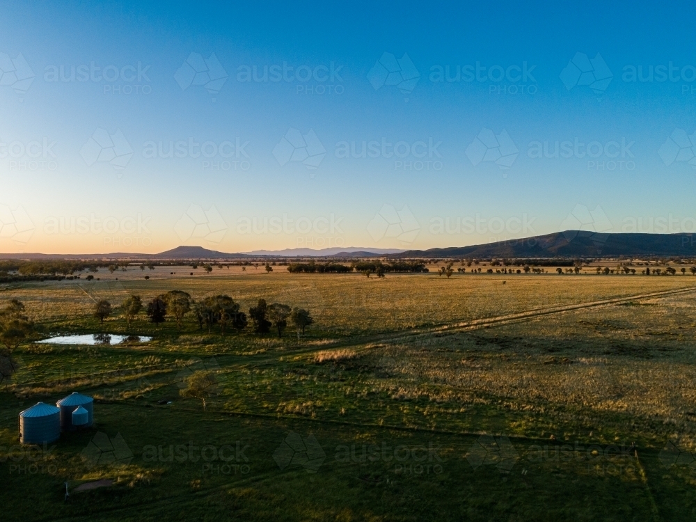 Image of Last light of the day over australian farm paddock seen from ...