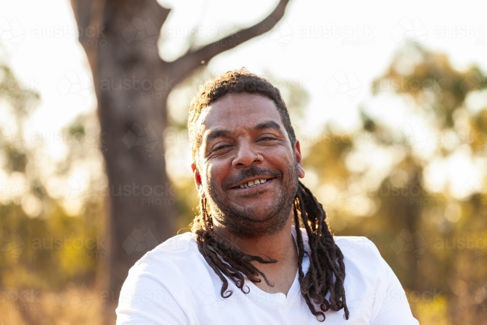 Image of Laughing aboriginal man in Australian country setting ...