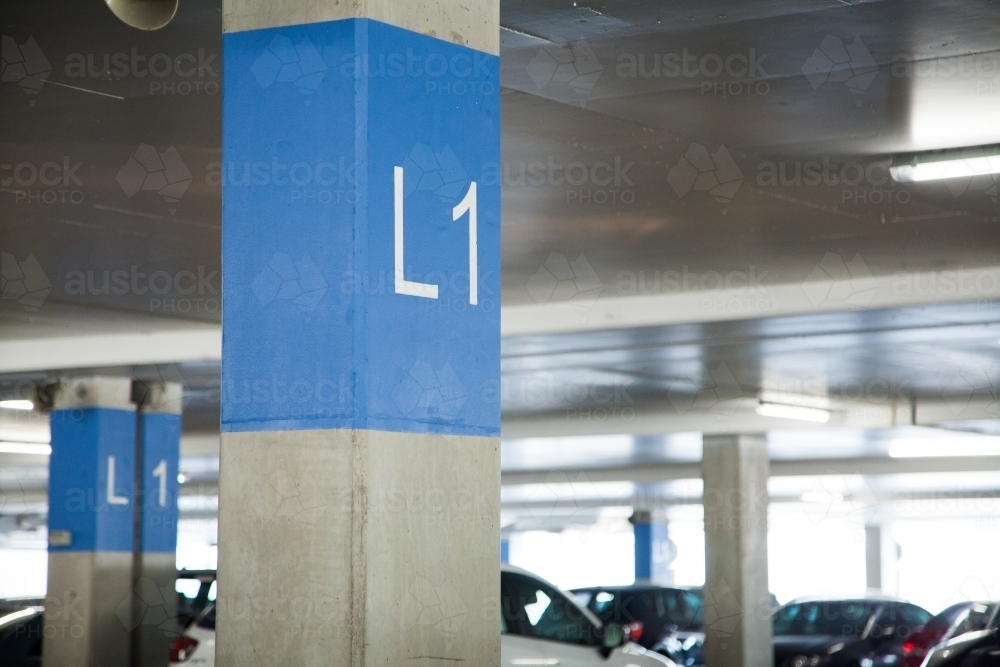 Image of Level 1 sign in car parking area - Austockphoto