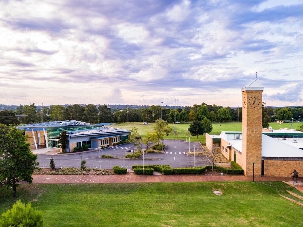 Image of Library with empty carpark and footpath to clock tower ...