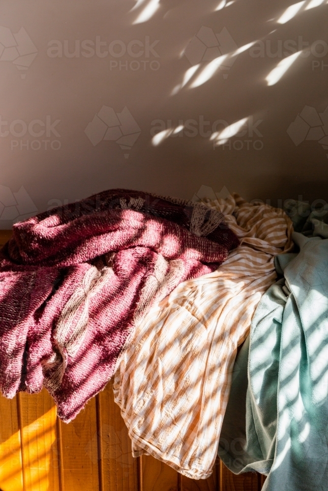 Image of Light and shadow in bars falling on pastel coloured warm ...