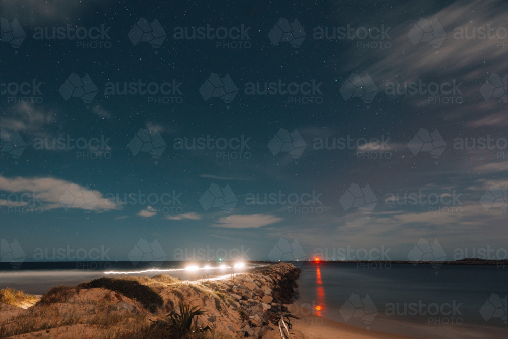 Image of Light trail along Iluka rock wall caused by people with torch ...