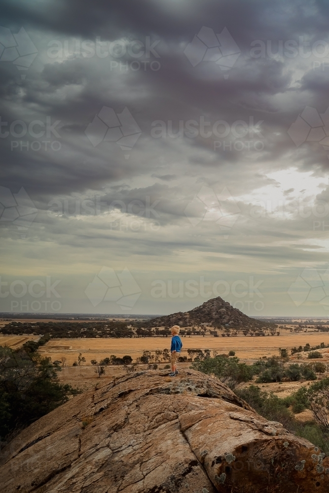Image of Little boy on outdoor adventure with Pyramid Hill in the ...