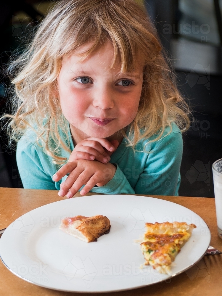 Image of Little girl eating lunch - Austockphoto