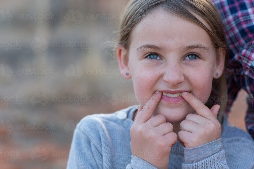 Image of Little girl showing her healthy teeth - Austockphoto
