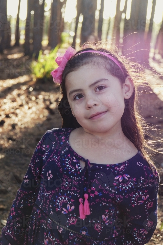 Image of Little multicultural girl in the wood - Austockphoto