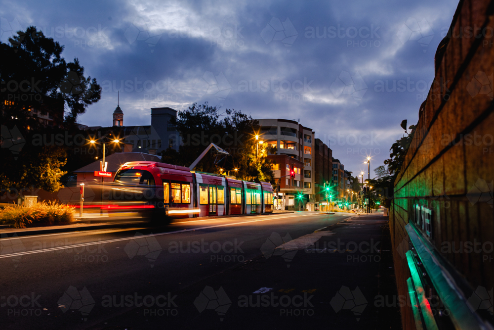 Image of Long exposure red light rail train waiting at Newcastle Beach ...