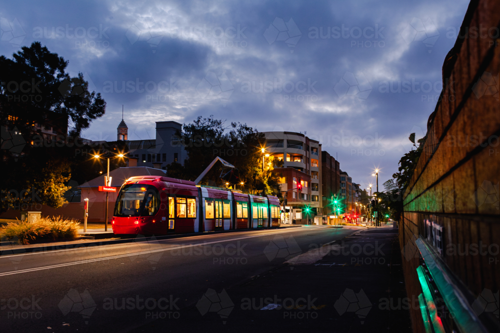 Image of Long exposure red light rail train waiting at Newcastle Beach ...
