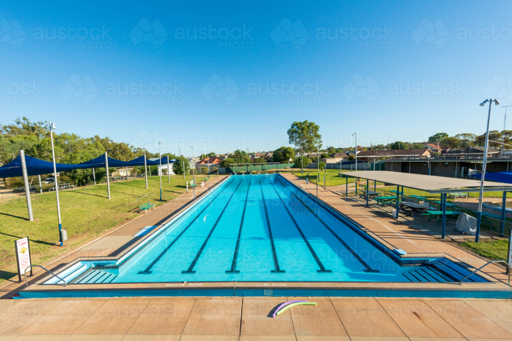 Image of Long outdoor swimming pool with multiple lanes marked for lap ...