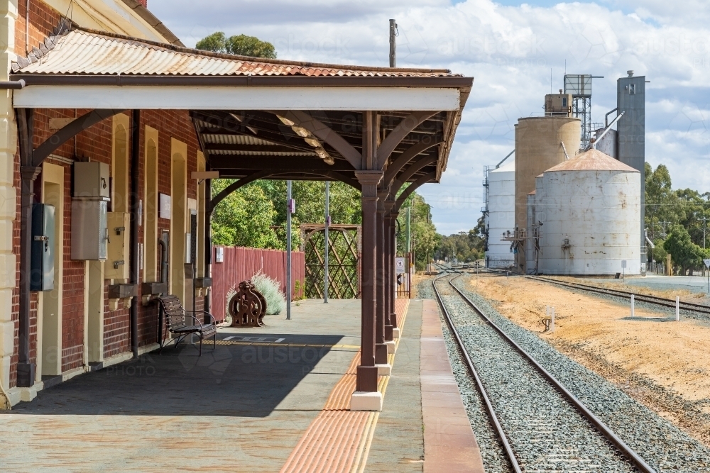 Image of Looking along a rural railway platform, down the railway line ...