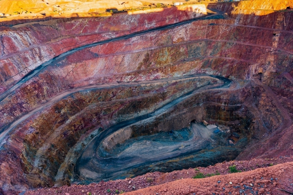 Image of Looking down into an open cut mine with roads winding down to ...