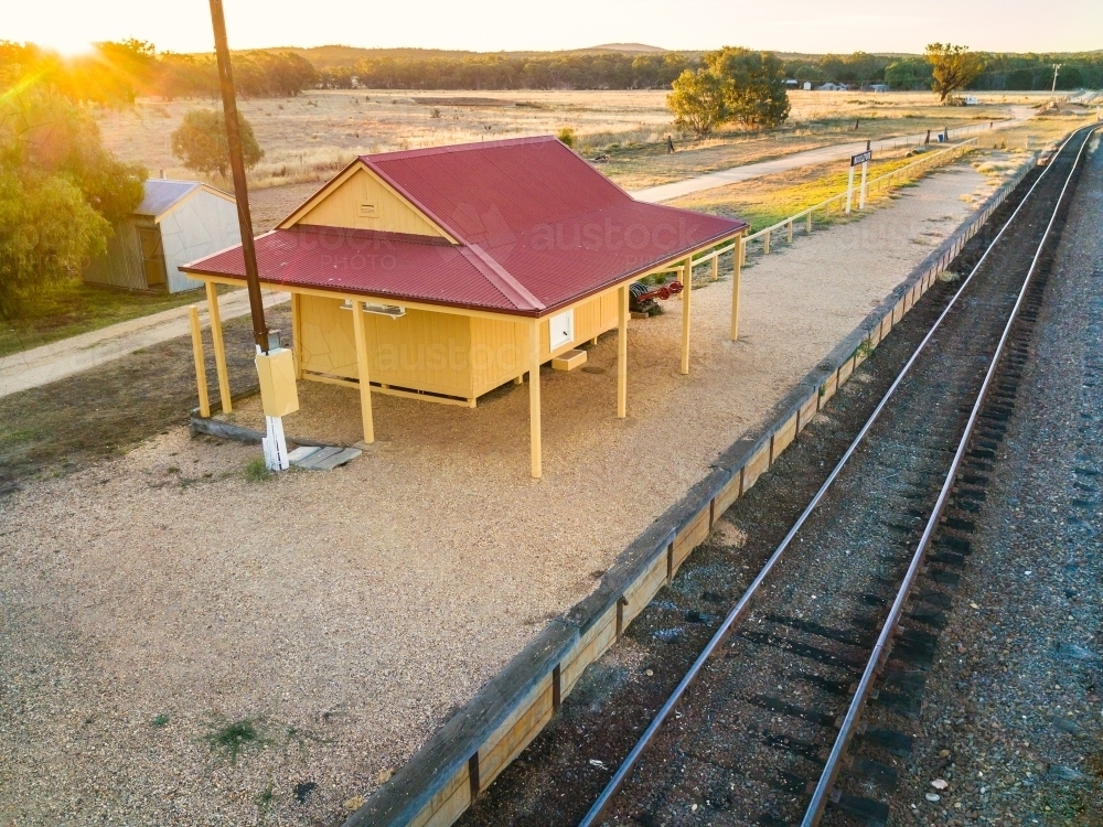 Image of Looking down on a small country railway station on a platform ...