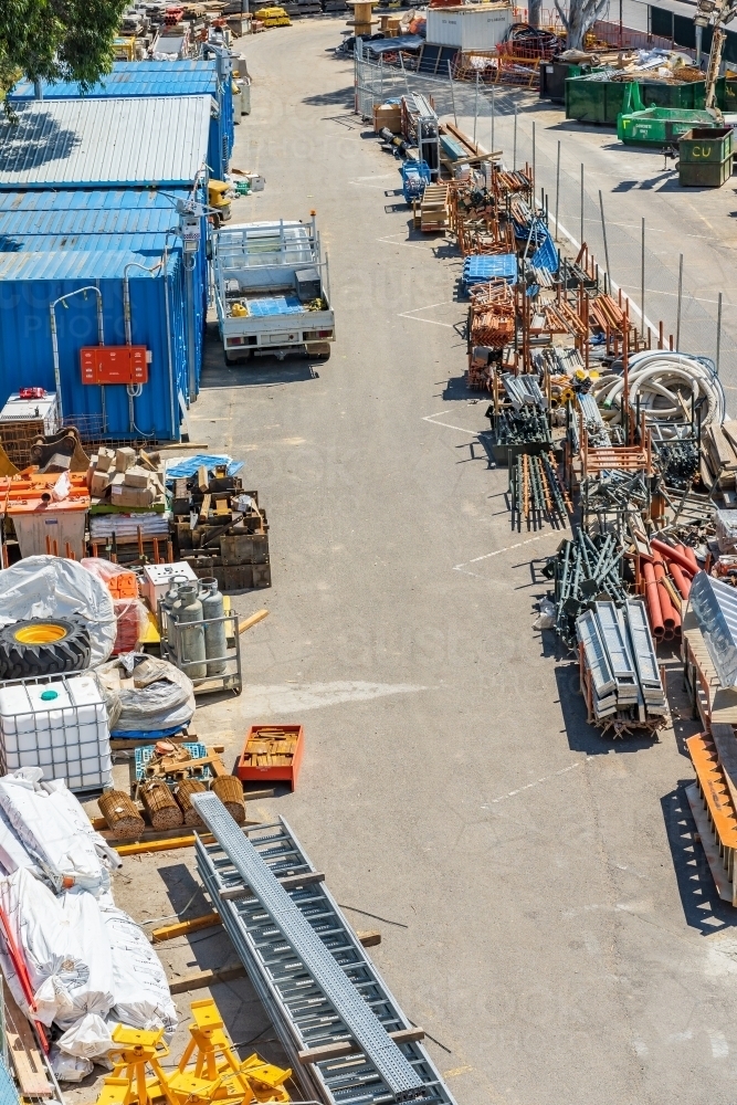 Image of Looking down on construction yard stacked with building ...