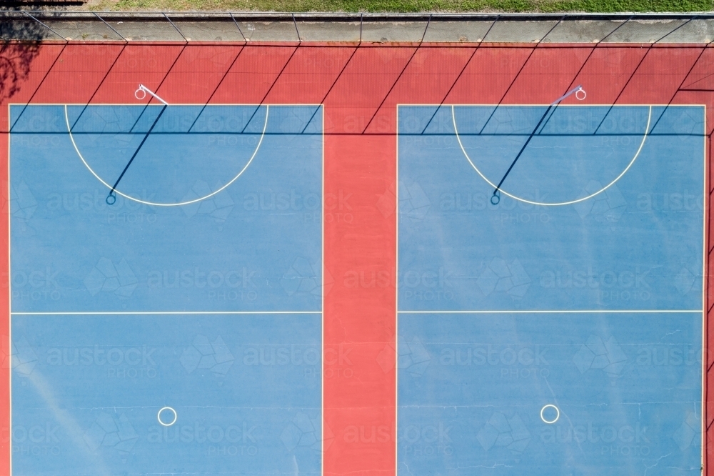 Image of Looking down on netball courts. - Austockphoto