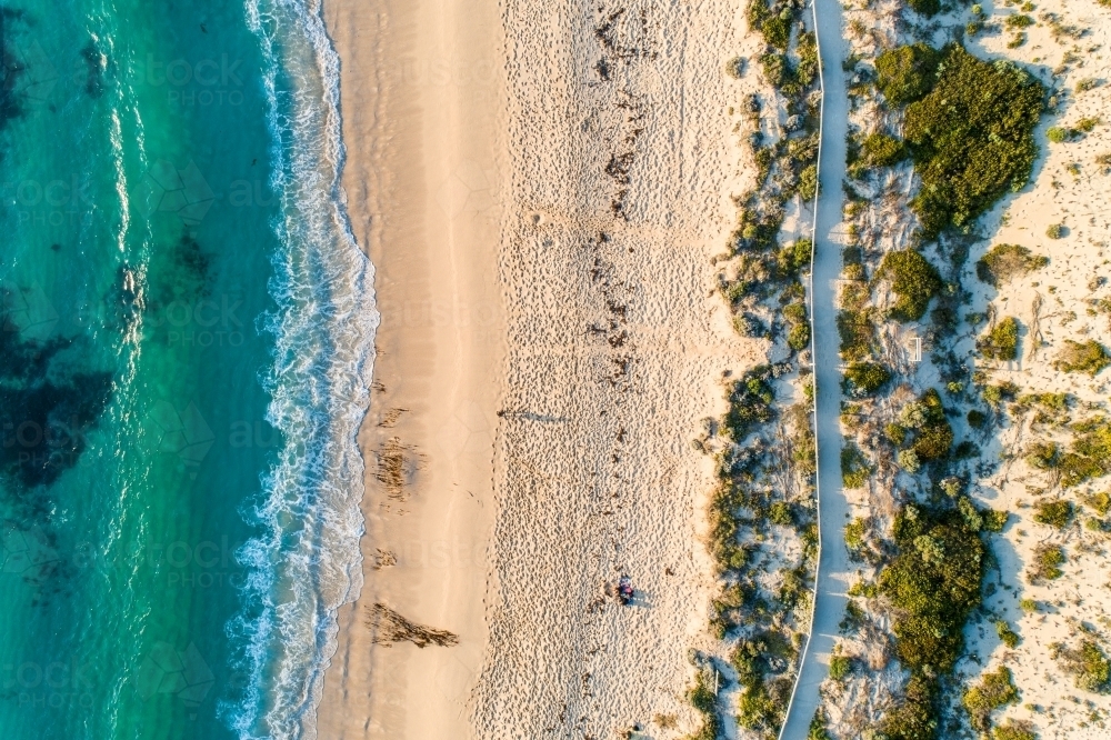 Image of Looking down on ocean, beach, and coastal pathway. - Austockphoto