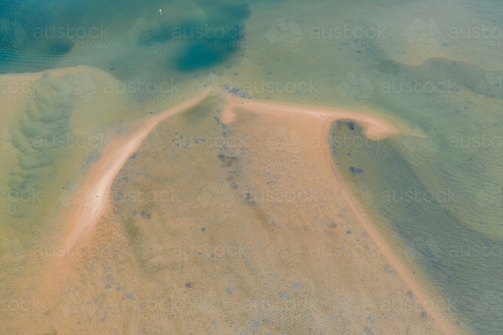 Image of Looking down on sand bars and tidal patterns in a coastal ...