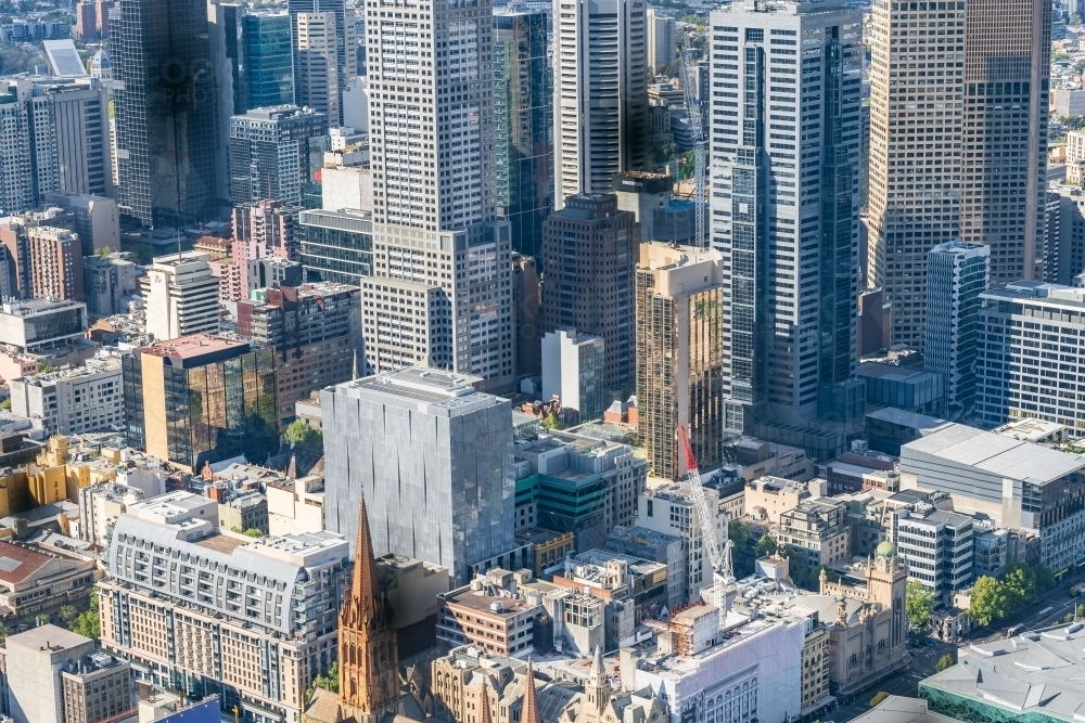 Image of Looking down on tightly packed city buildings of varying ...