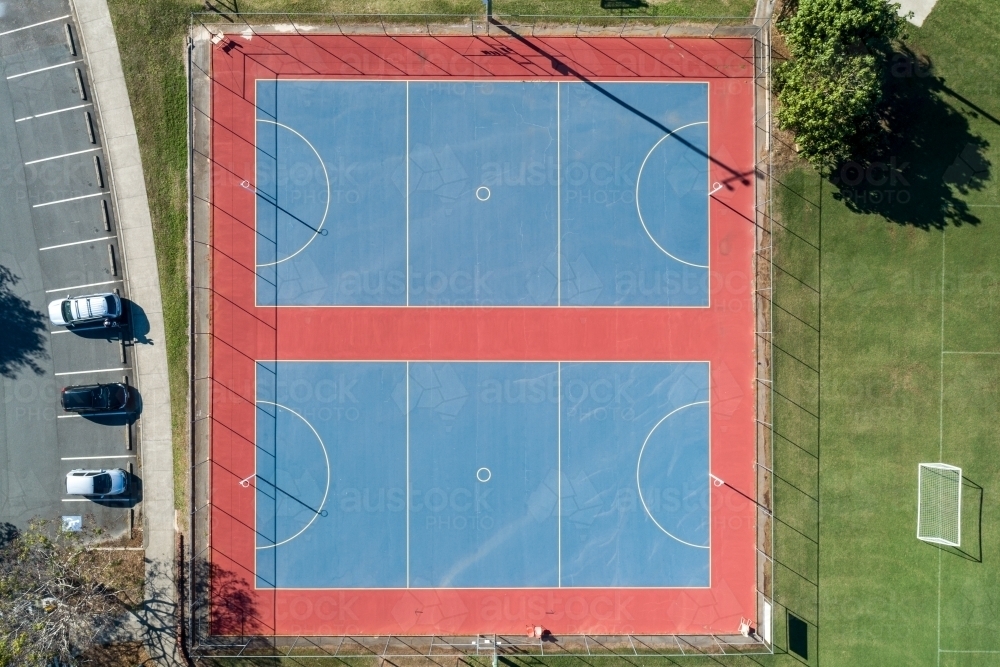 Image of Looking down on two netball courts. - Austockphoto