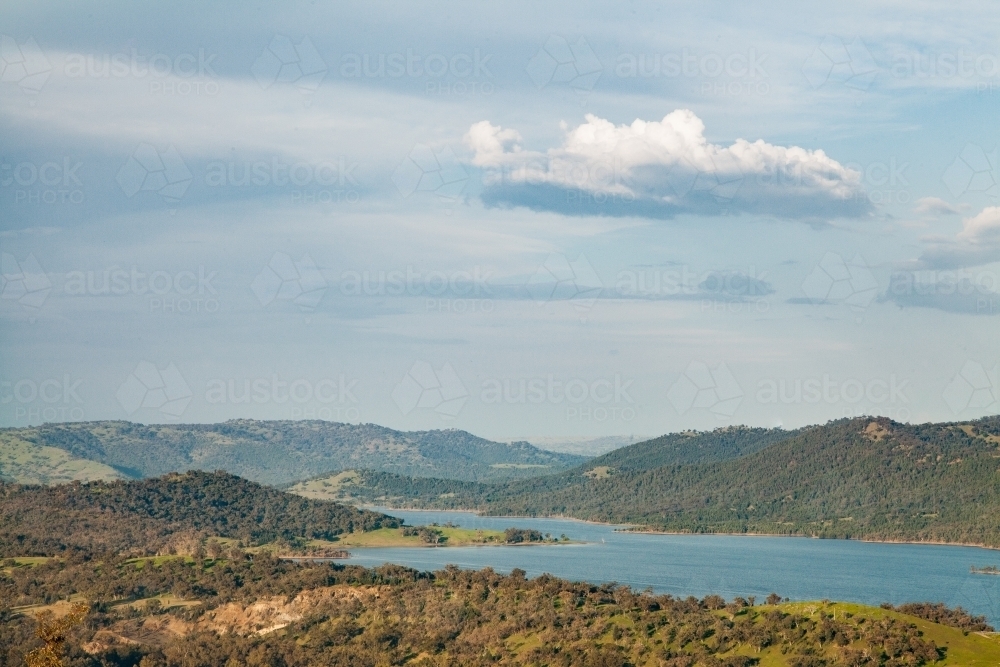 Image of Looking down over a lake at midday - Austockphoto